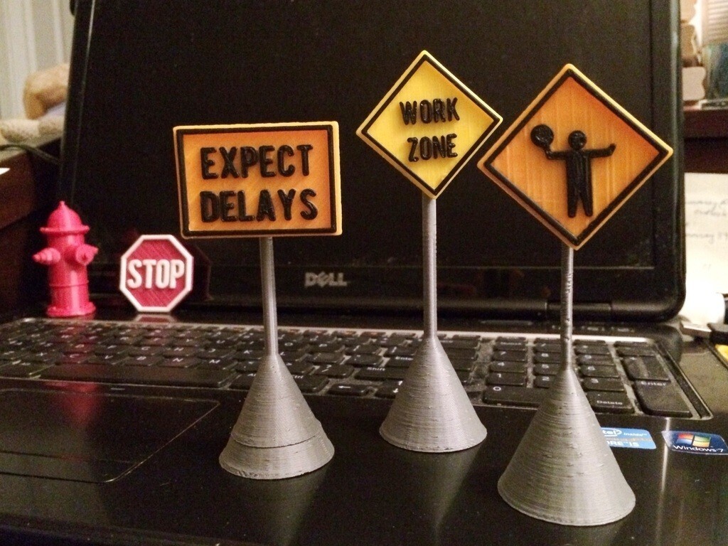 Free STL file Road Signs for your desk (on a post), lapel (pins), or ...