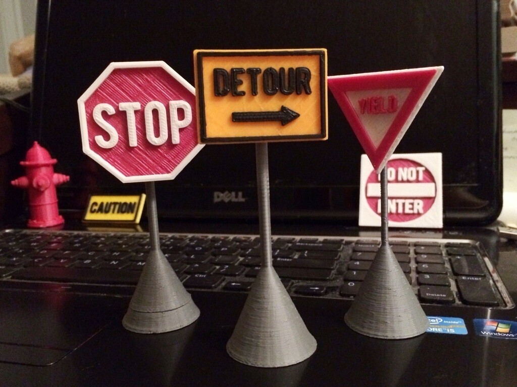 Free STL file Road Signs for your desk (on a post), lapel (pins), or ...